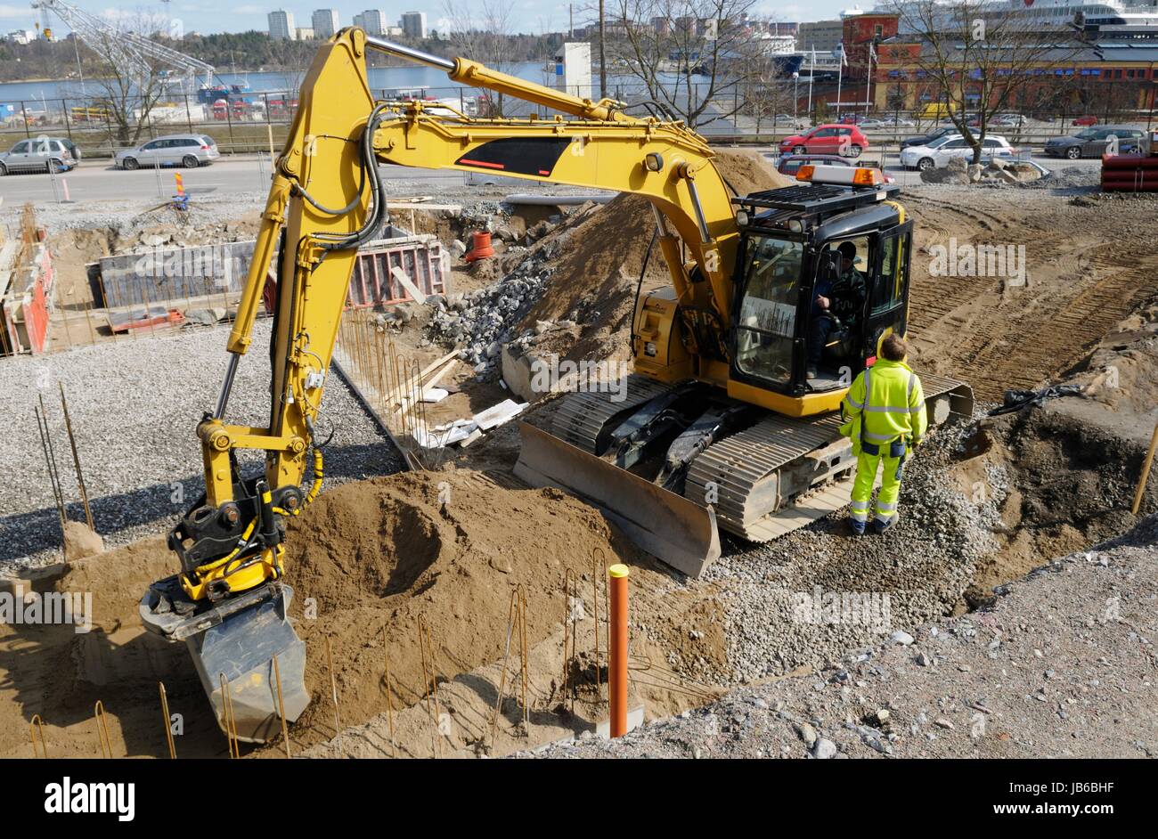 Digger on construction site Stock Photo - Alamy