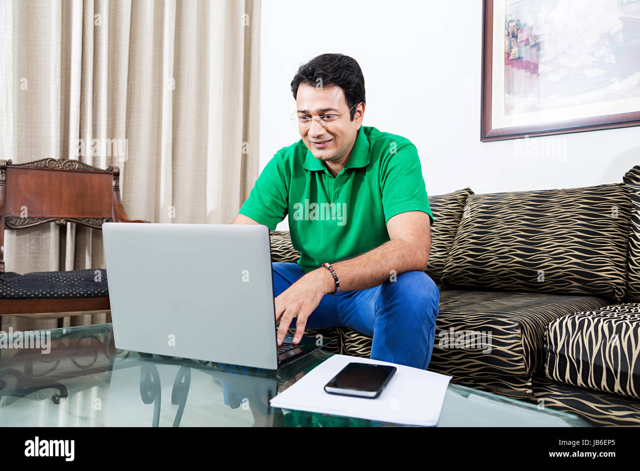 Indian man sofa hi-res stock photography and images - Alamy