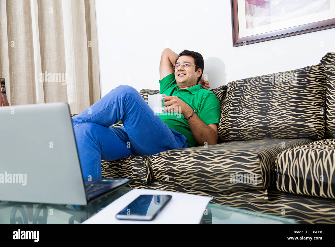 Indian man sofa hi-res stock photography and images - Alamy
