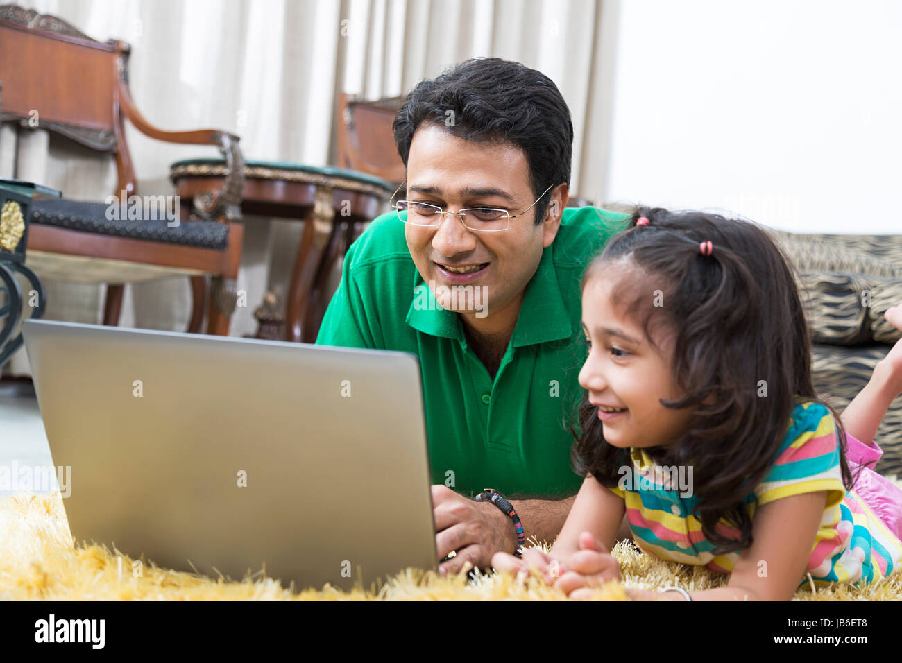Father daughter working on laptop hi-res stock photography and images ...