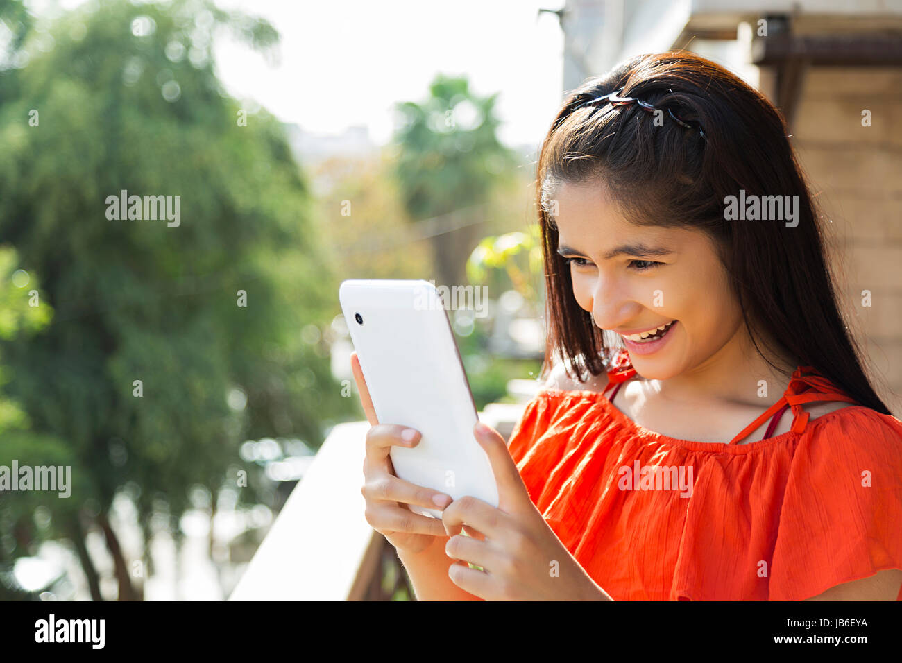 Teen girl reading tablet hi-res stock photography and images - Alamy