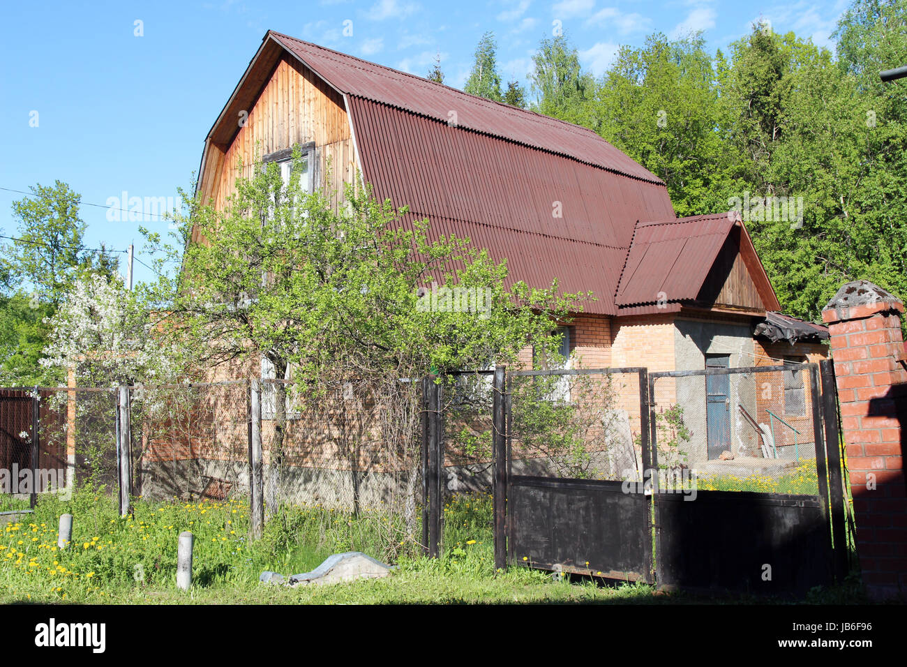 A countryside house with old gates and a fence. Eastern Europe, Russia ...