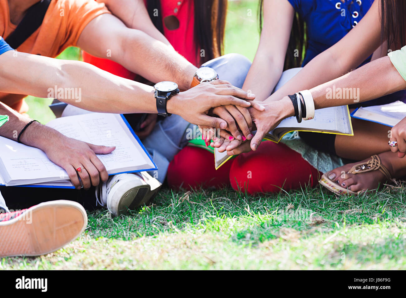 Team Huddle Hands Up Girls