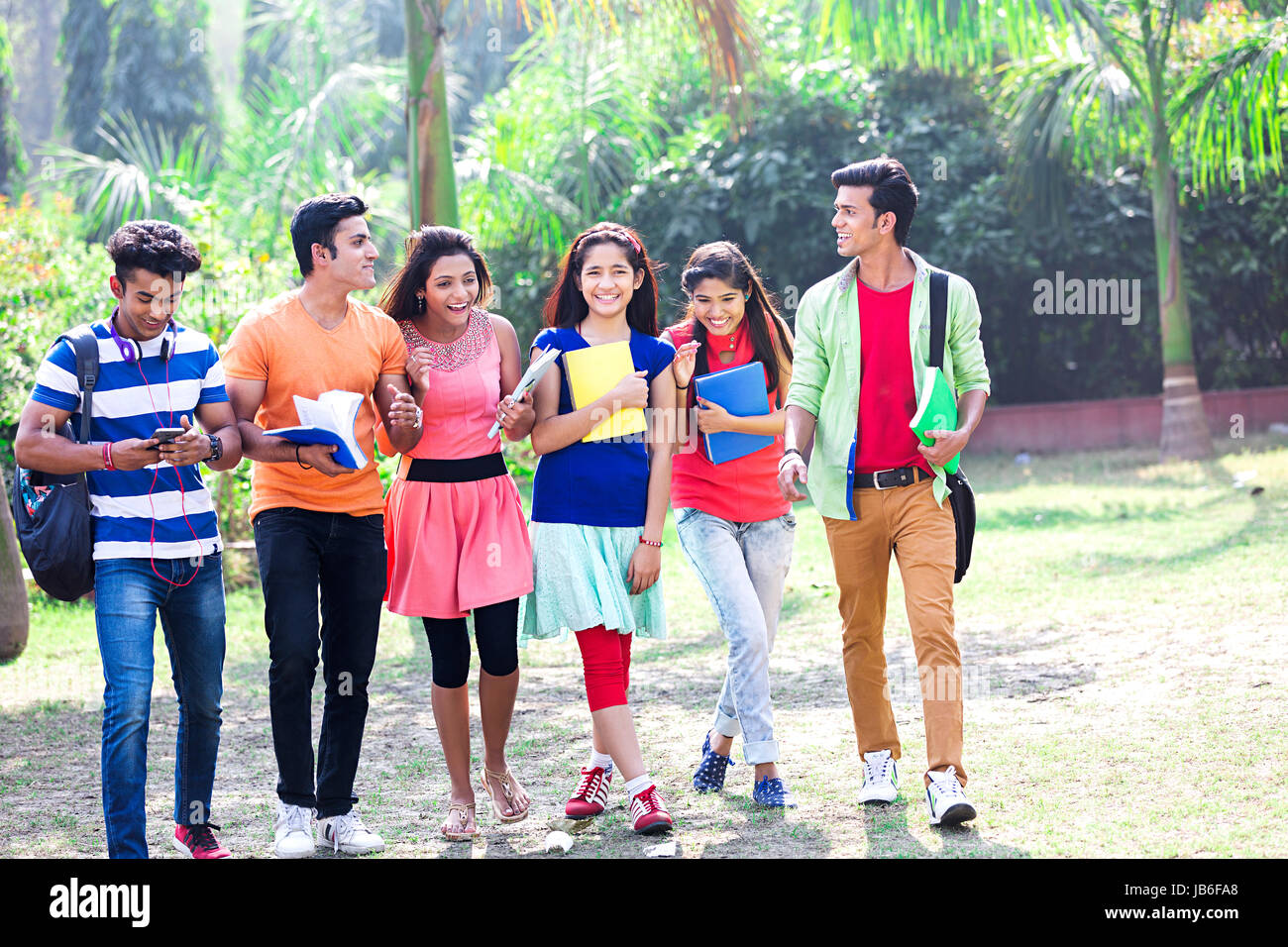 Group College Friends Students Gossip Walking Together In Park Stock ...