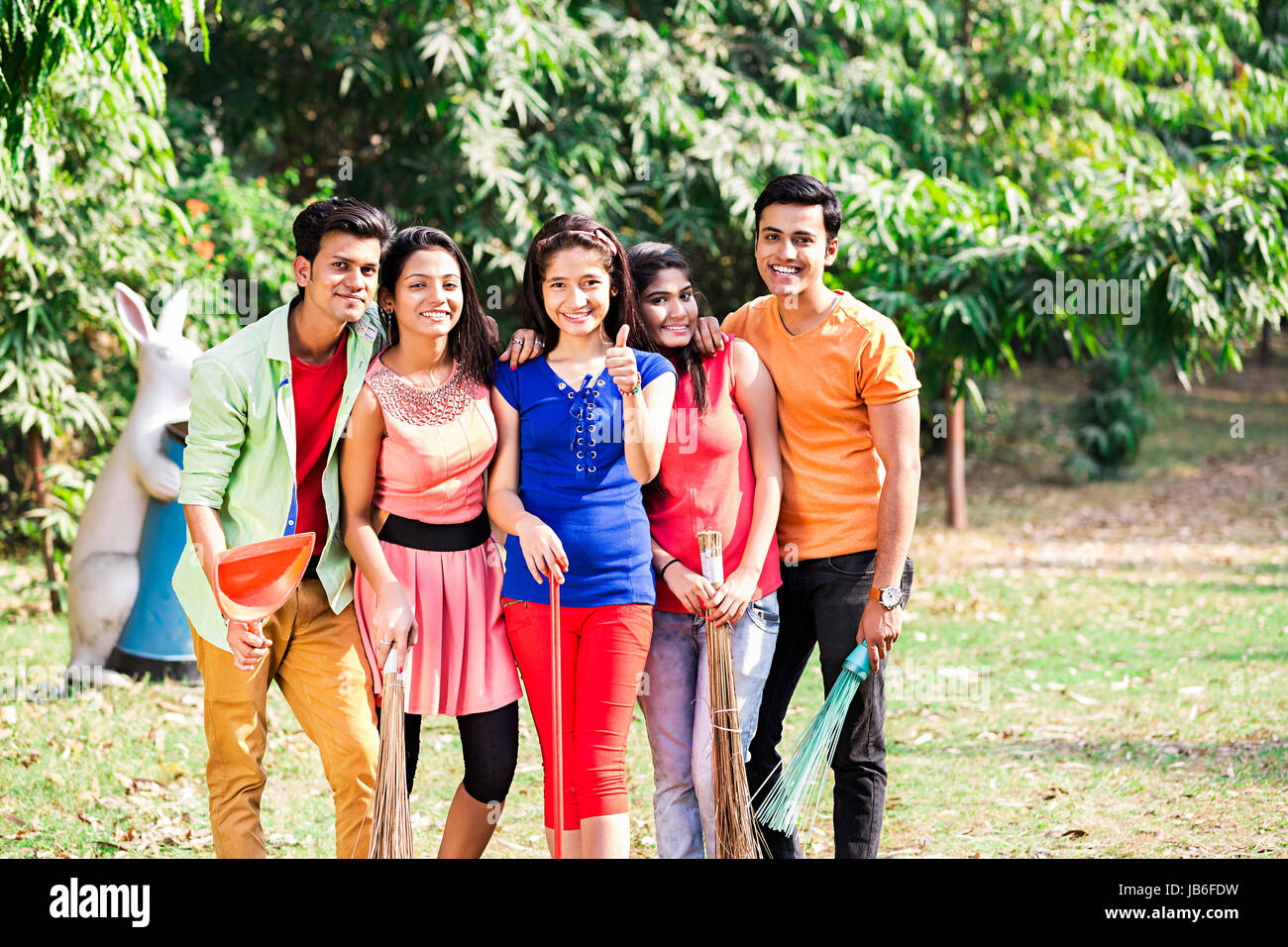 Indian College Friends Students Cleaning Garbage In Garden Environment ...