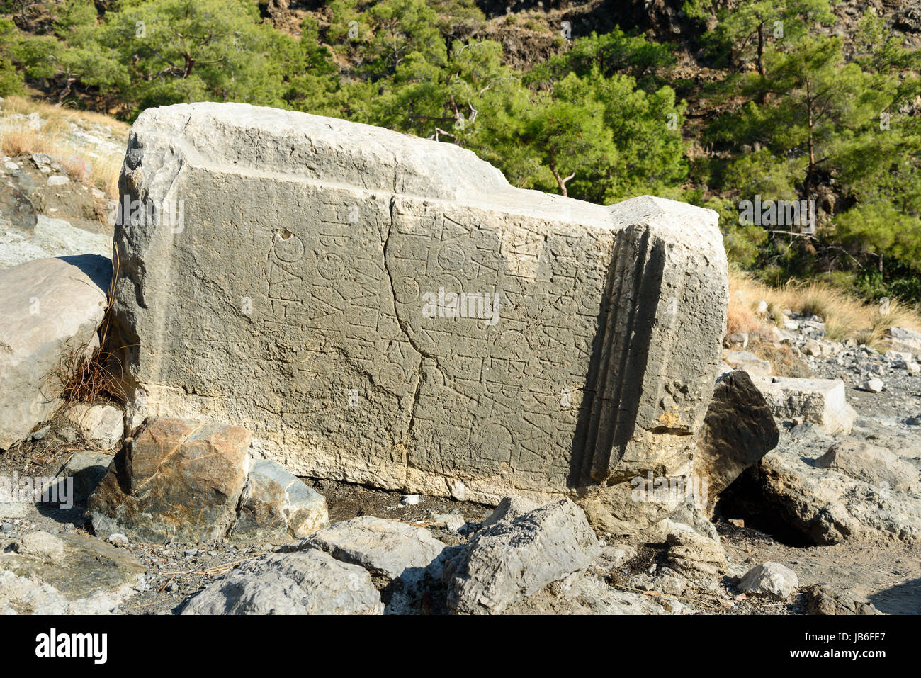 Stone with ancient Greek script. Ruins of temple of Hephaestus on ...
