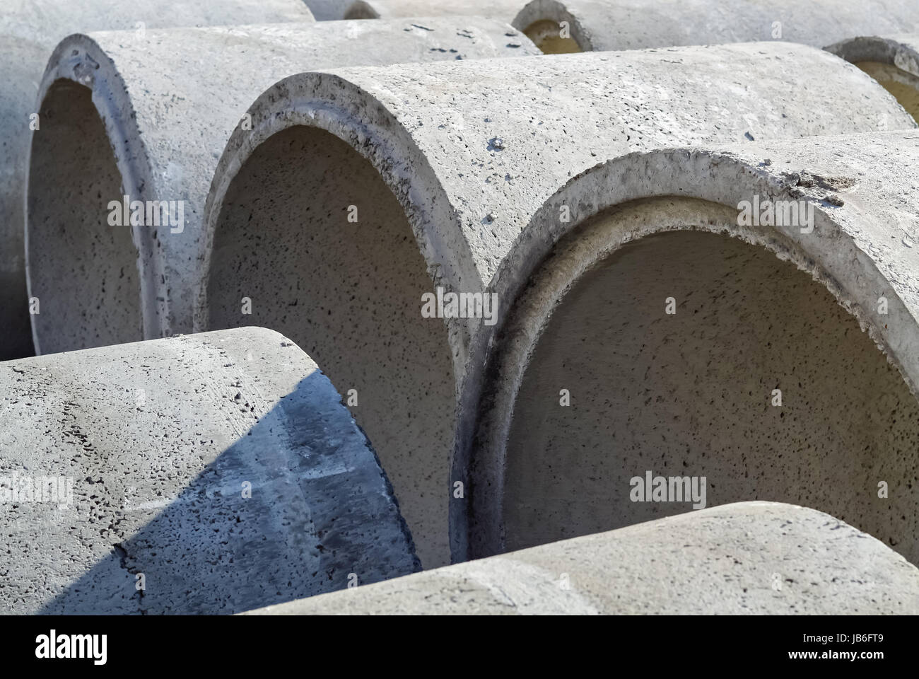 Closeup of many concrete pipes prepared for underground montage Stock ...