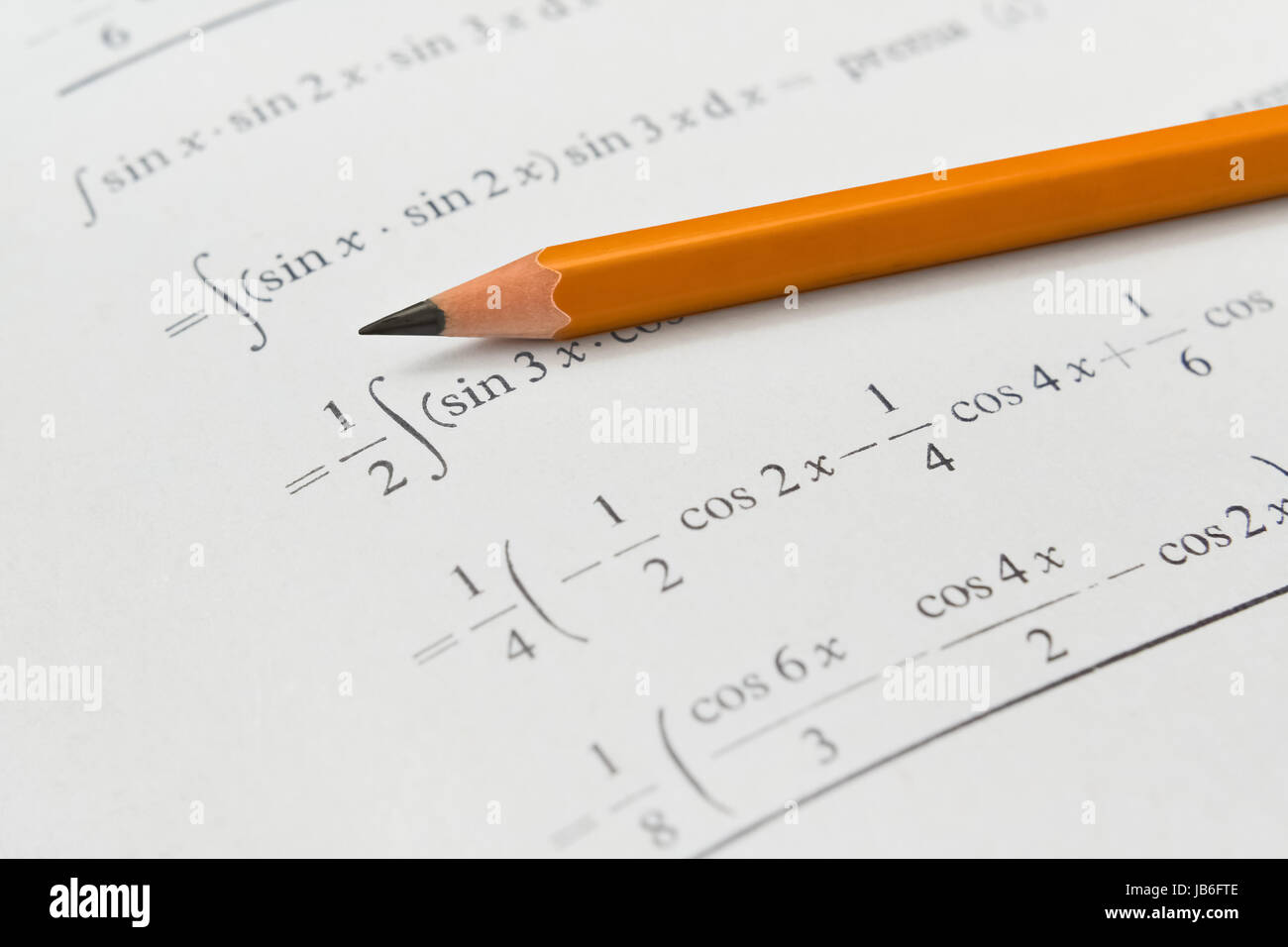 Closeup of a page of math book with integrals and trigonometric ...