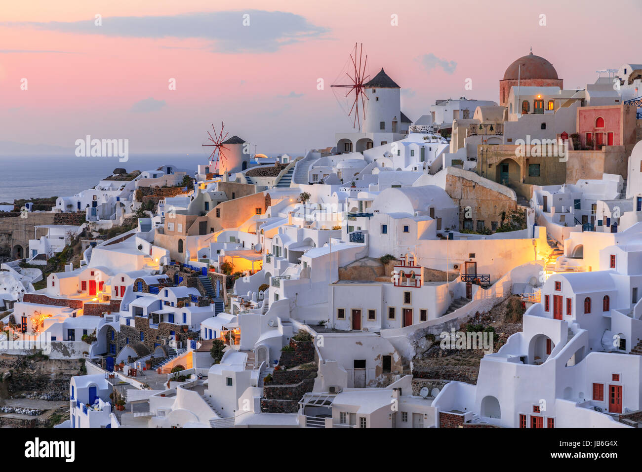 Sunset in Oia village, Santorini, Greece Stock Photo - Alamy