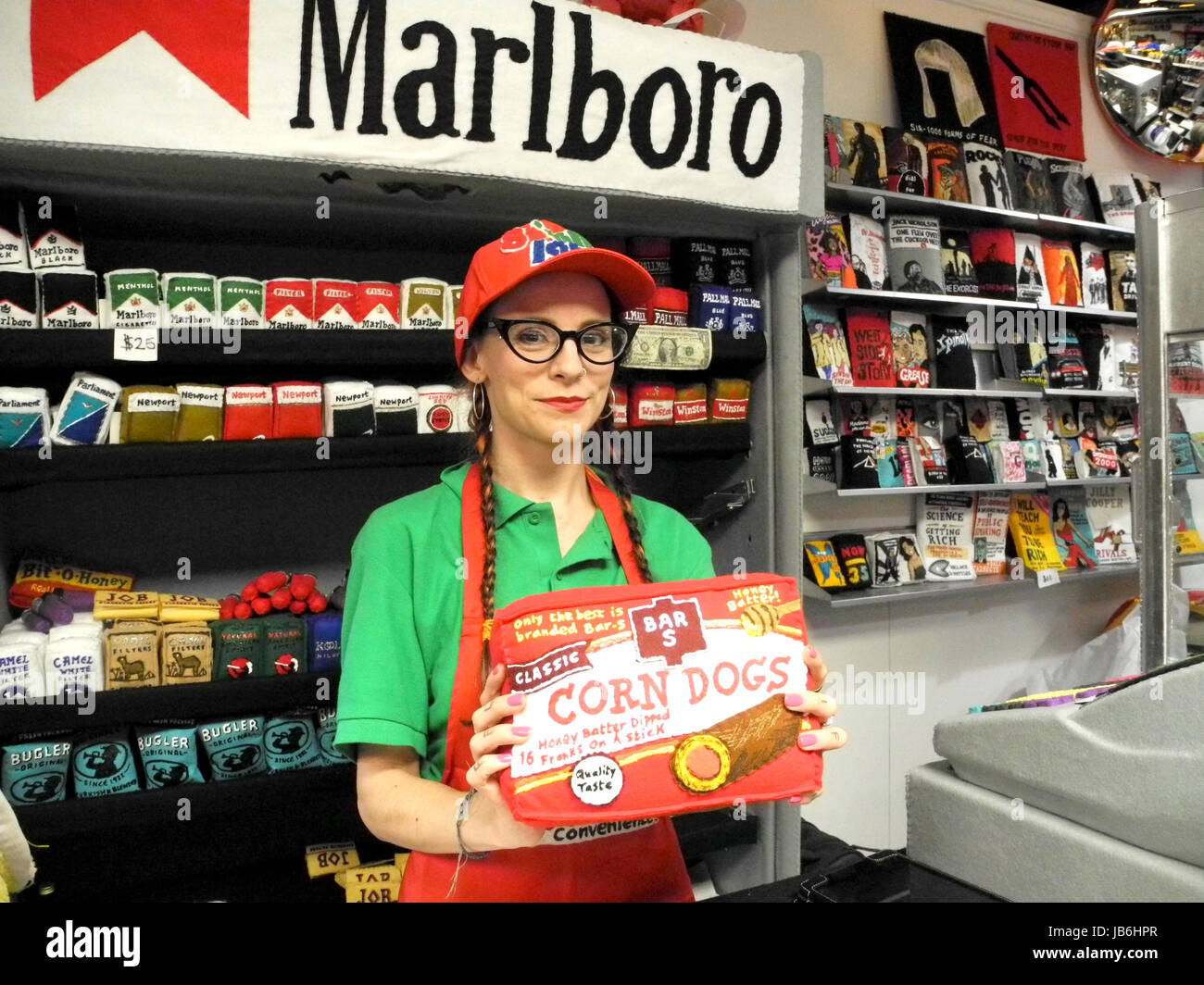 British artist Lucy Sparrow stands inside of her grocery store '8 'till ...