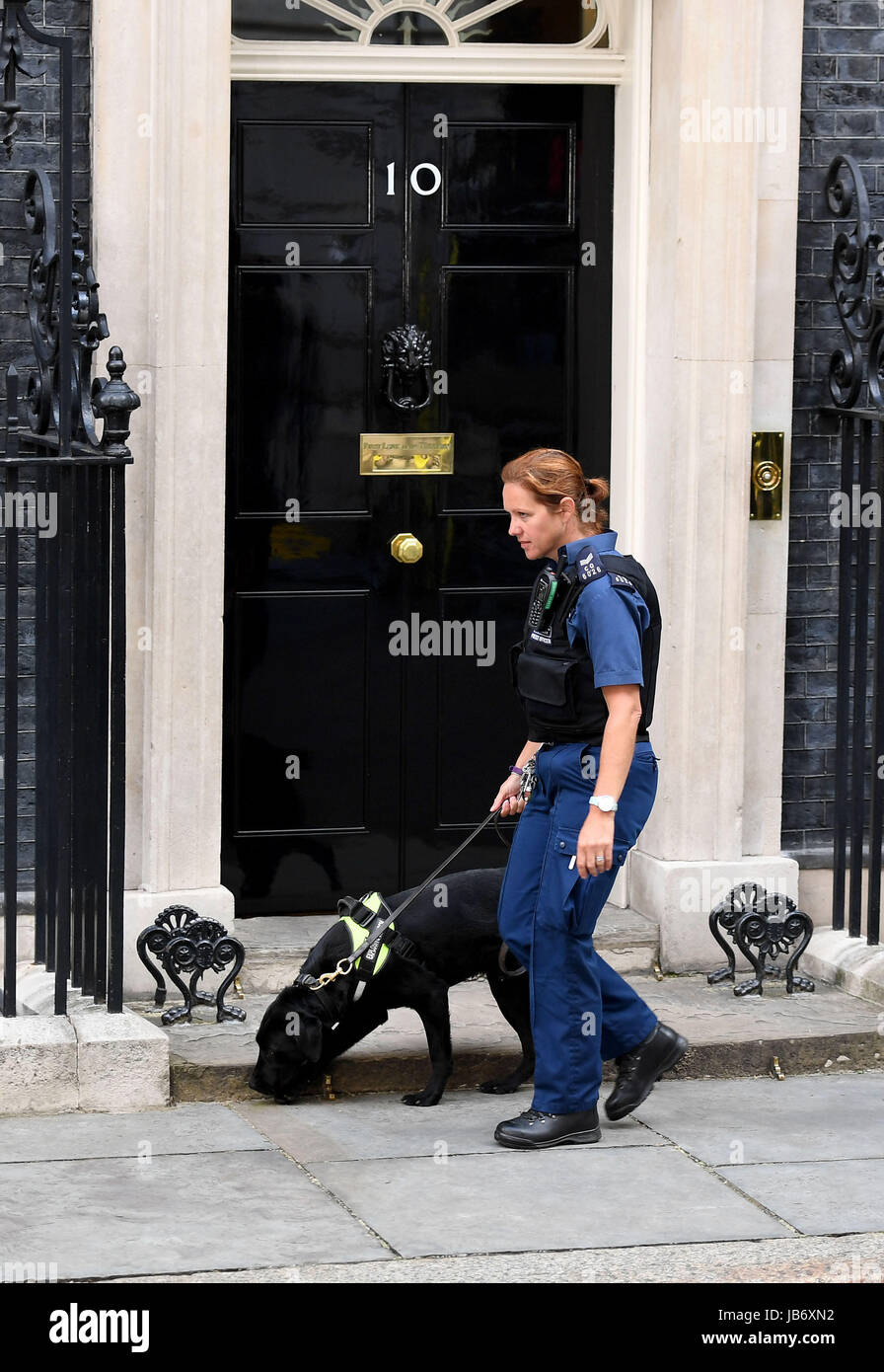Police patrolling at Number 10 Downing Street, London, UK. Security at ...