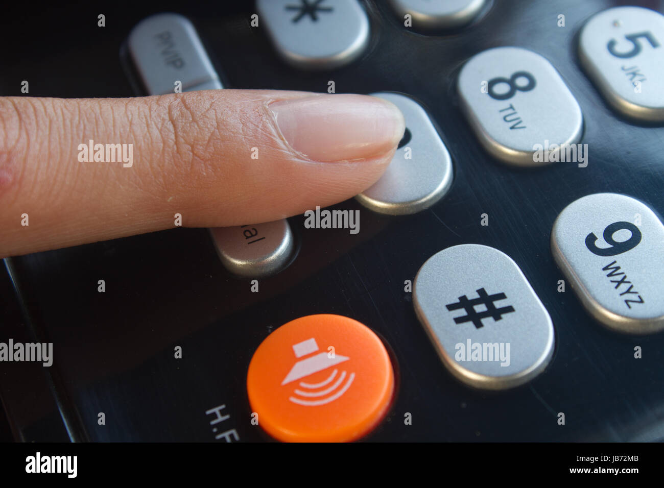 black telephone with hand press the button Stock Photo - Alamy