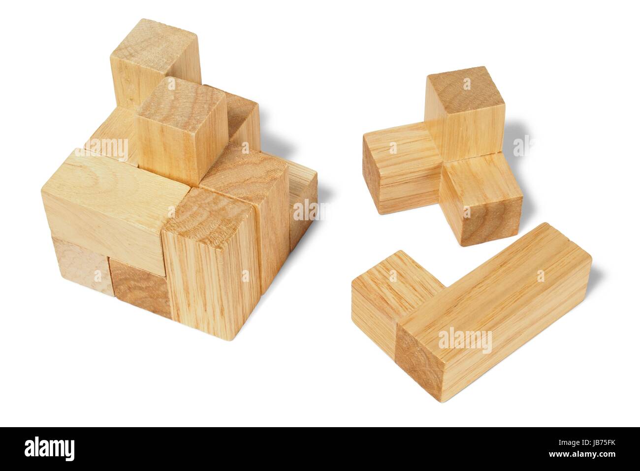 Wooden logic puzzle on white background Stock Photo - Alamy
