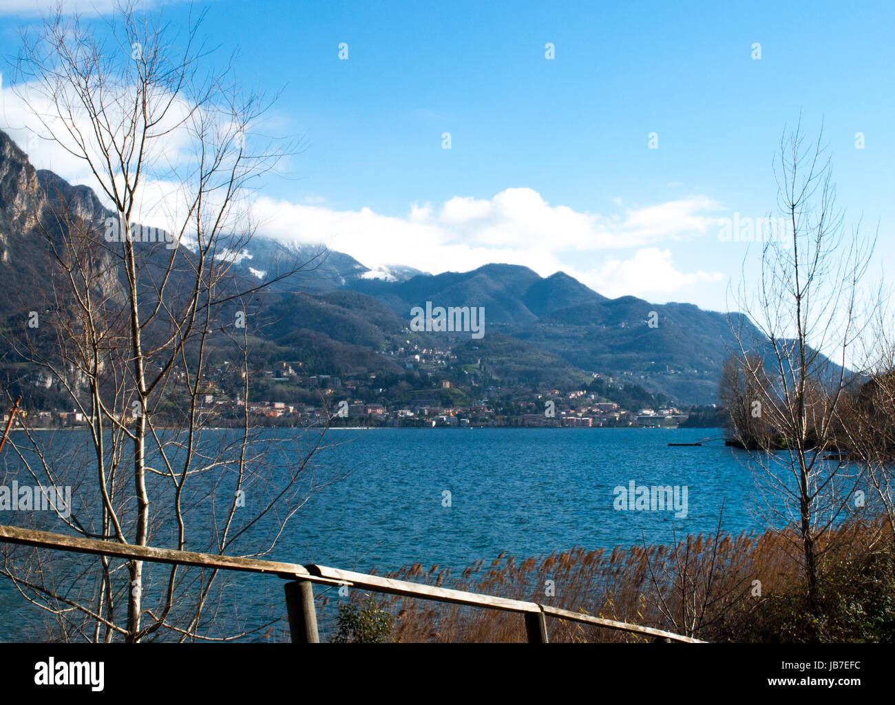 picturesque landscape with the blue water of Lake Como surrounded by ...