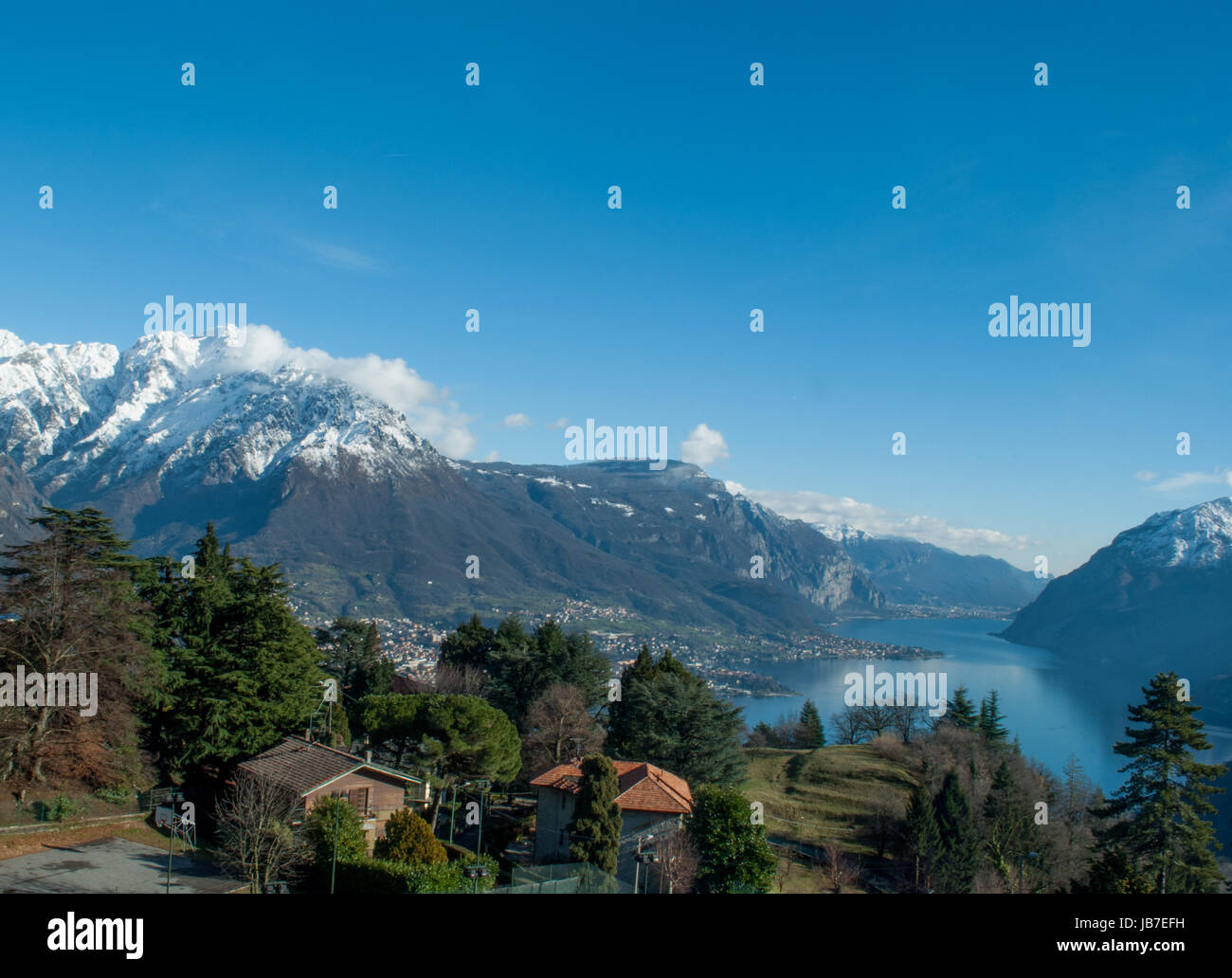 picturesque landscape with the blue water of Lake Como surrounded by ...