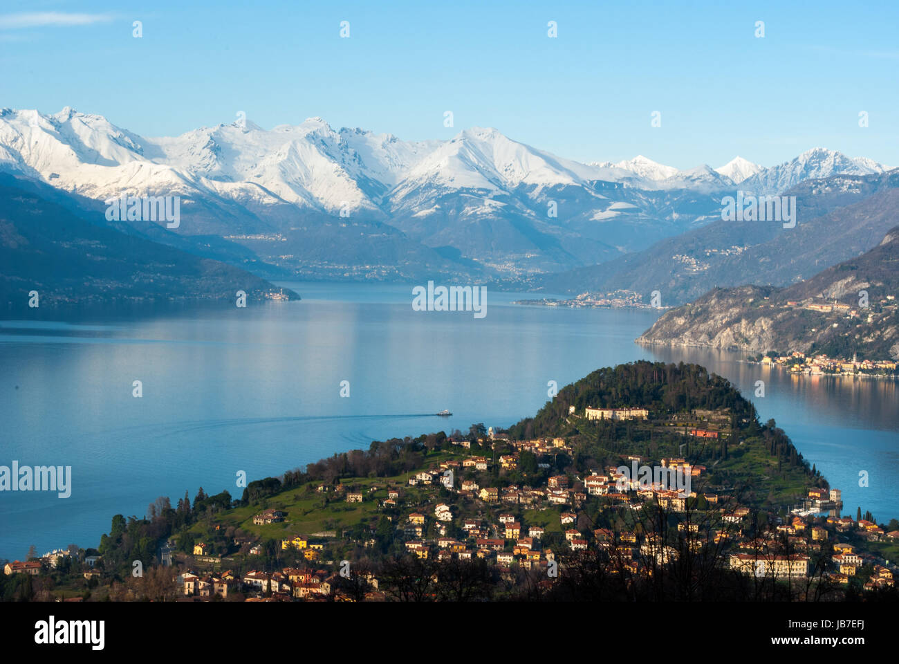 picturesque landscape with the blue water of Lake Como surrounded by ...