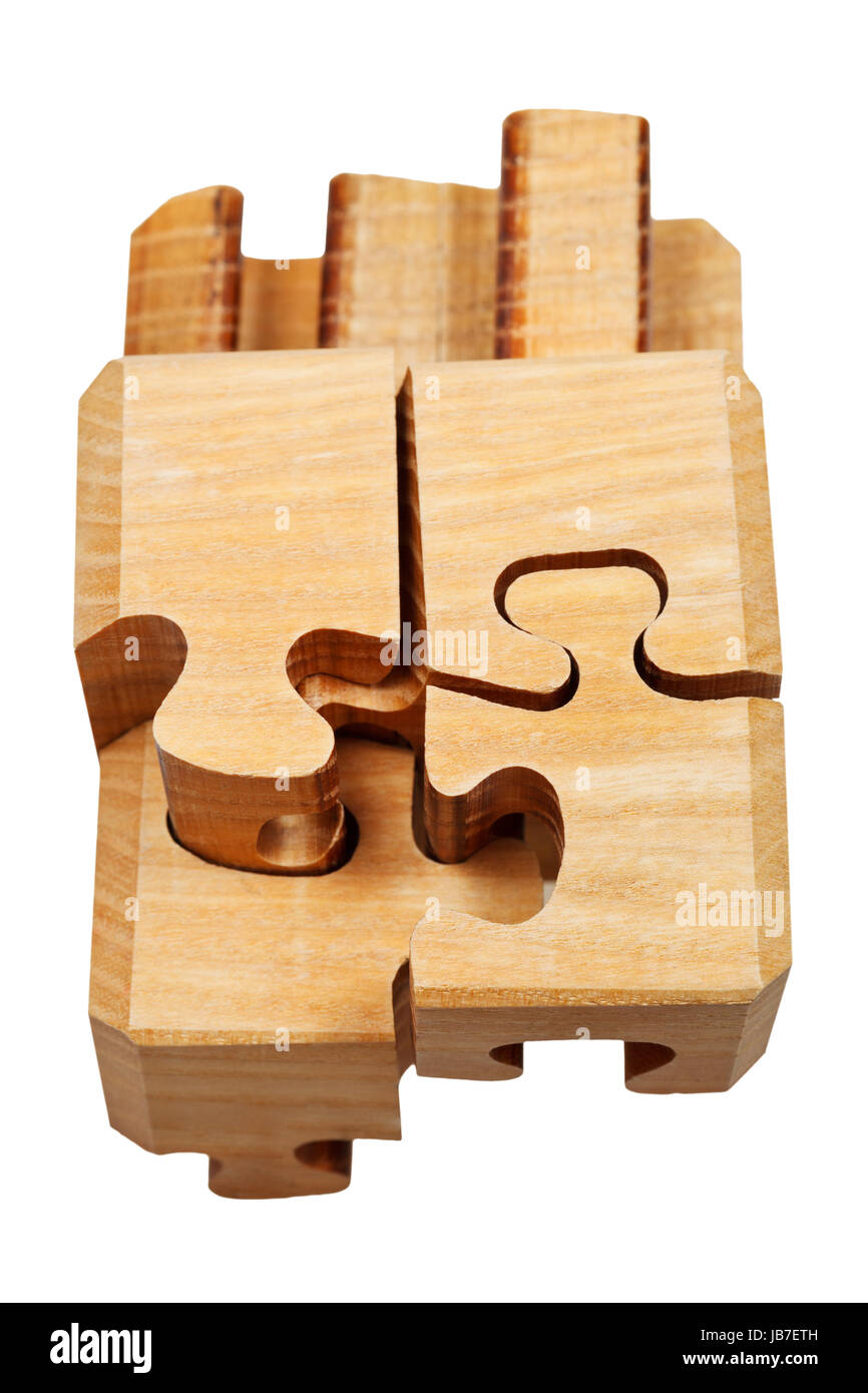 assembling of three dimensional wooden mechanical puzzle close up ...