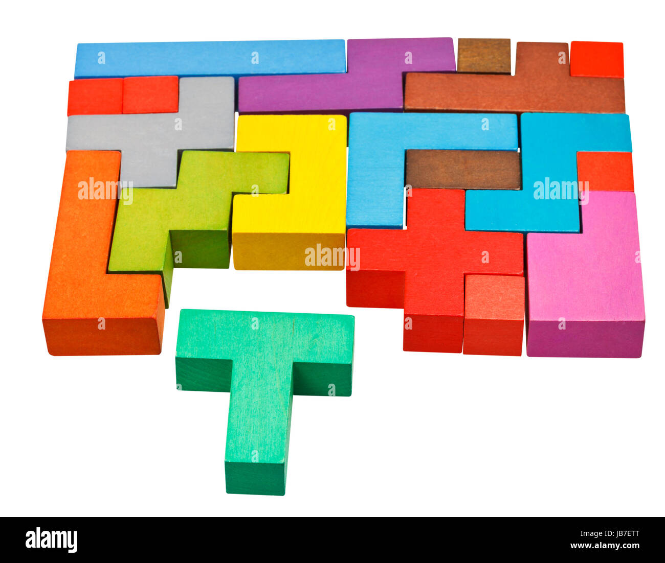 multicoloured puzzle blocks and T-shaped piece isolated on white ...