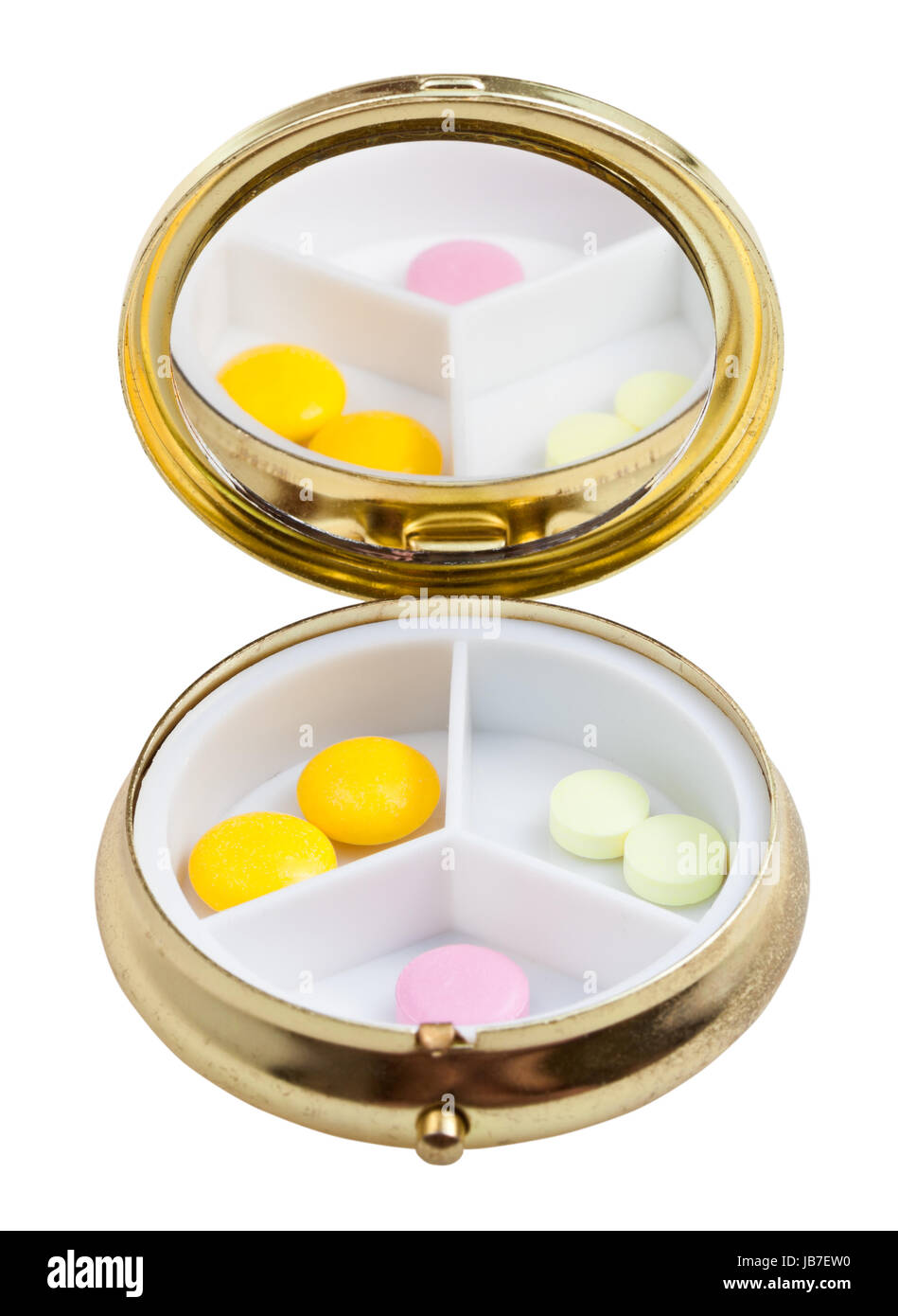 compact pill box with mirror and several tablets isolated on white ...