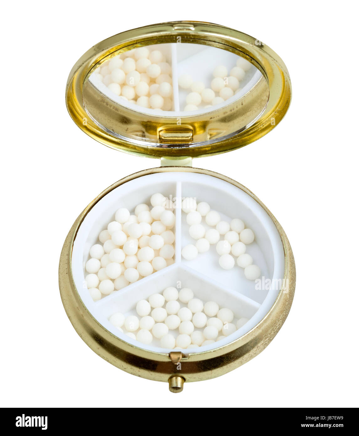 compact pill box with mirror and sugar homeopathy balls isolated on ...
