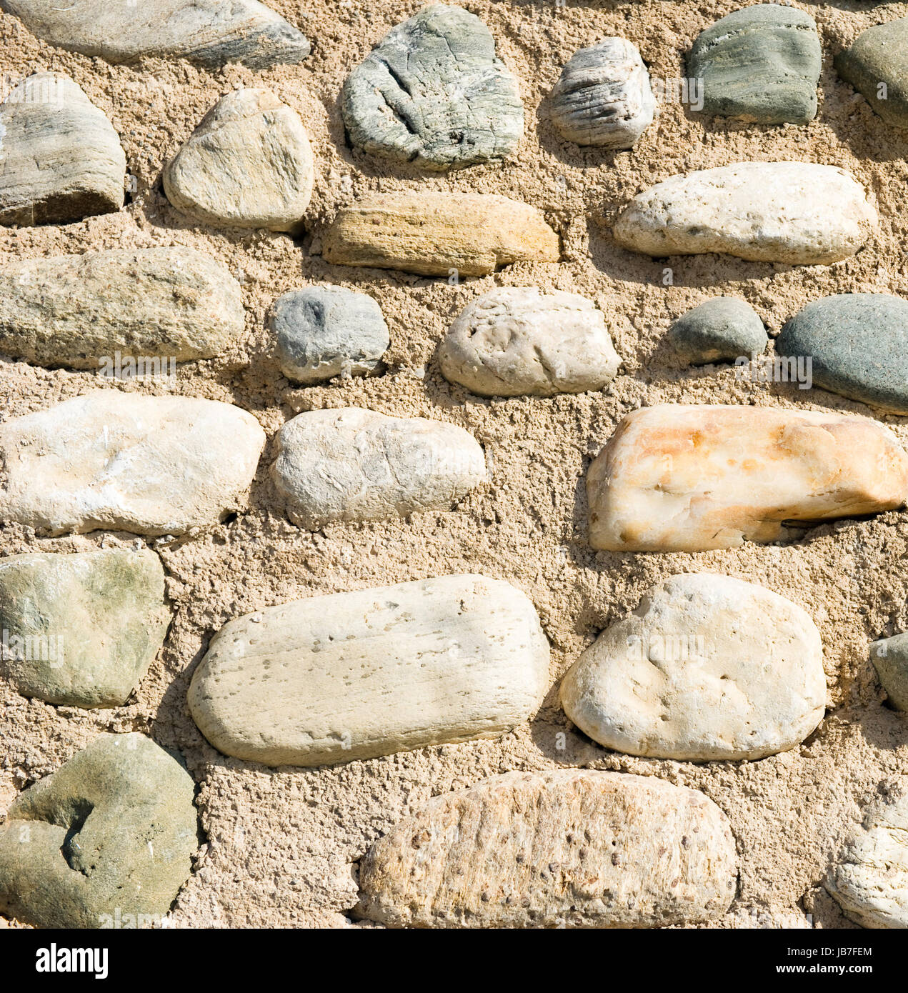 Sand and stones background Stock Photo - Alamy