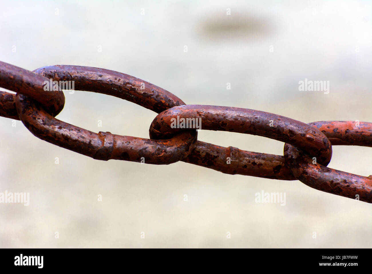 Old metal chain on a light background in sunlight Stock Photo - Alamy