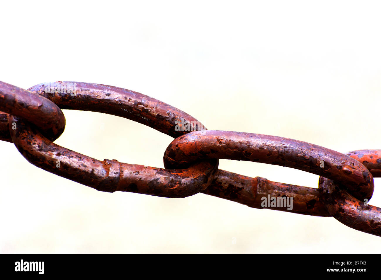 Old metal chain on a light background in sunlight Stock Photo - Alamy