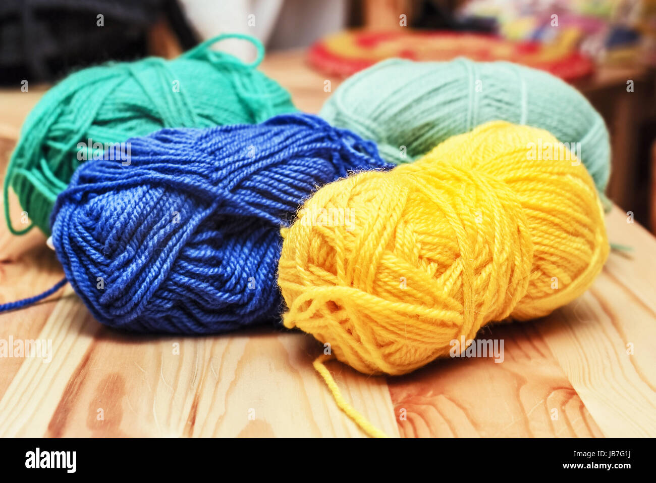 Nice multi-colored skeins of wool in room Stock Photo - Alamy