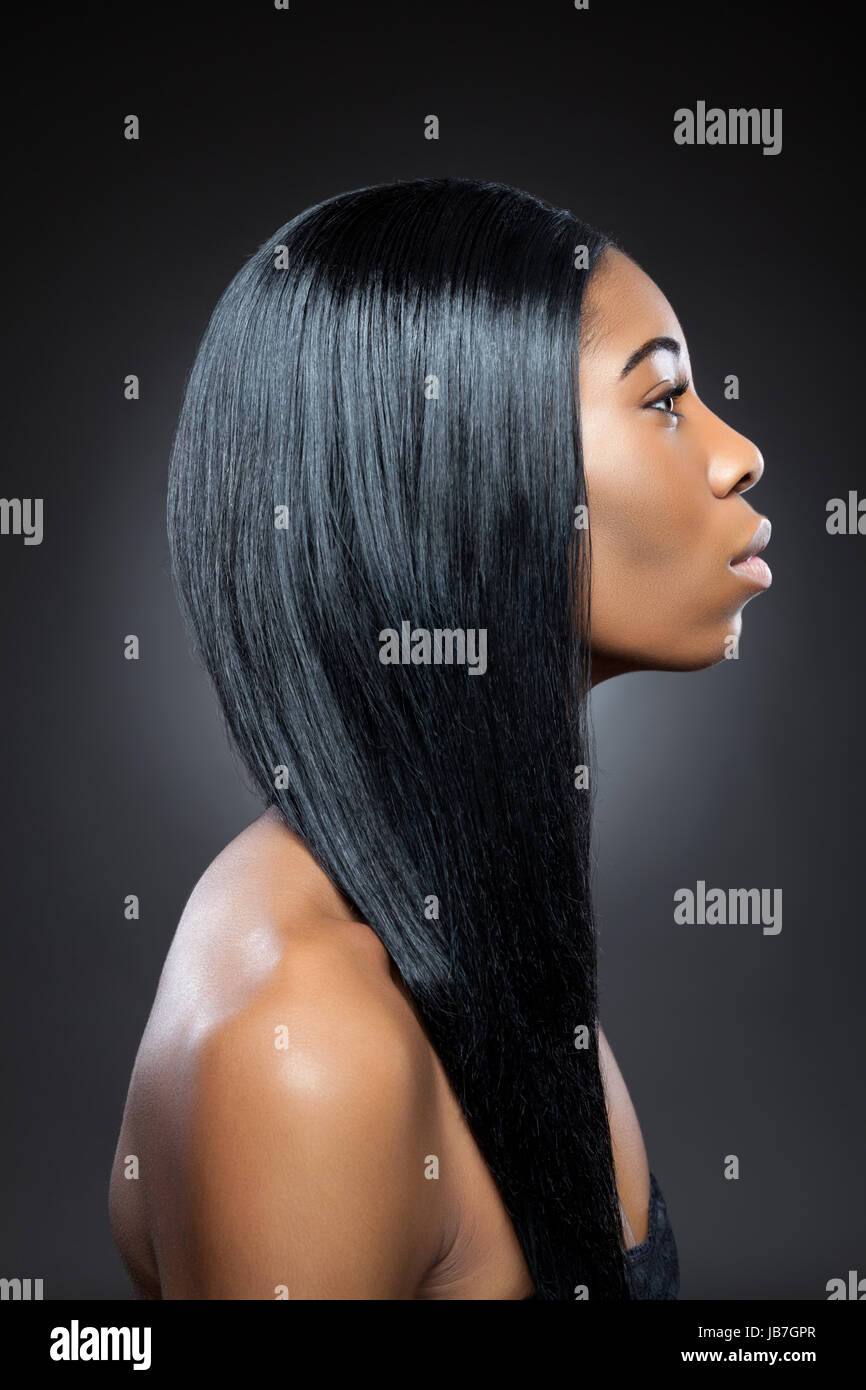 Young black beauty with long straight hair Stock Photo - Alamy