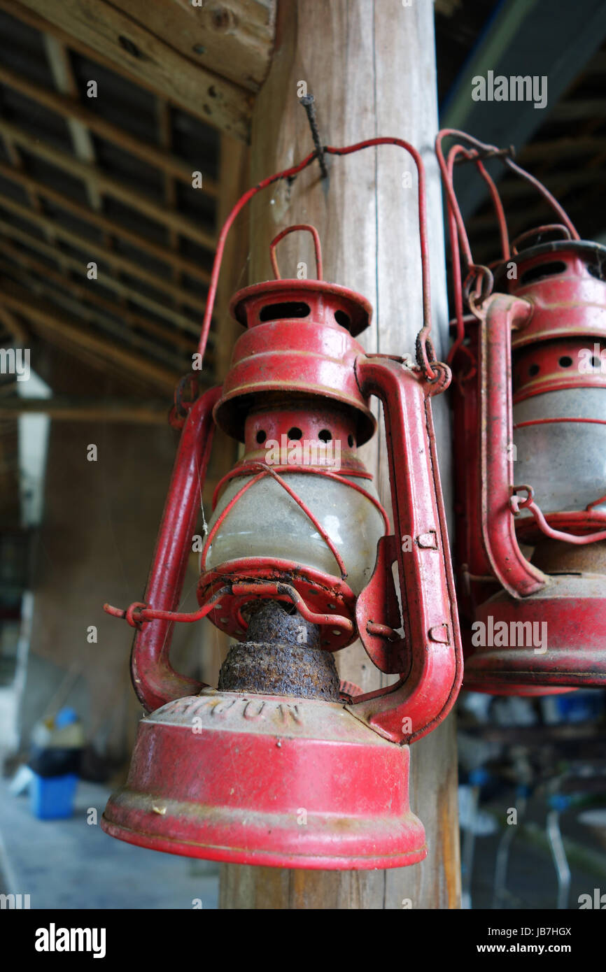 Antique kerosene lamp hanging on old wood Stock Photo - Alamy