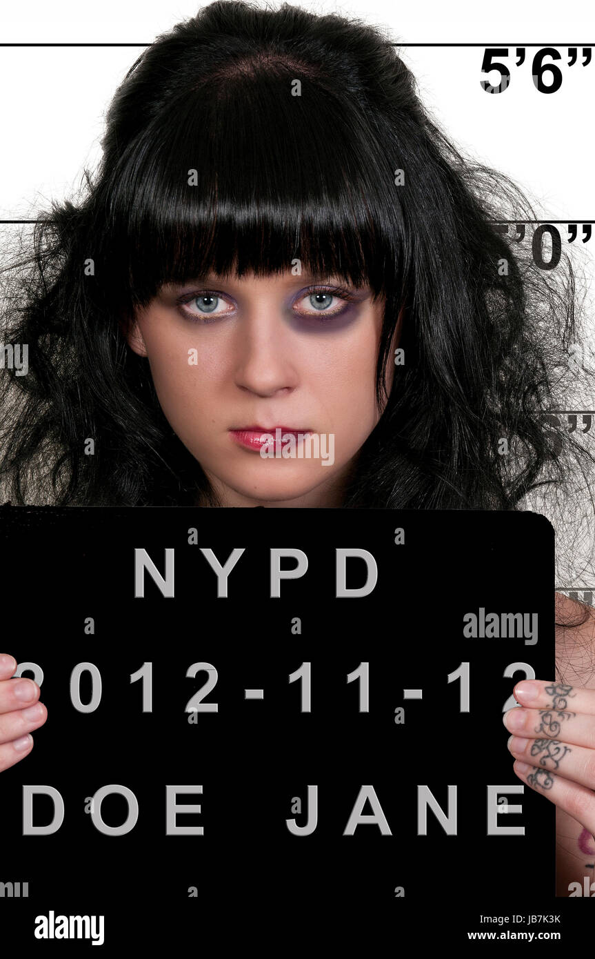 Mugshot of a beautiful young woman criminal Stock Photo - Alamy