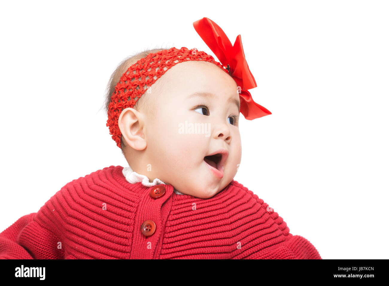 Baby girl looking back Stock Photo - Alamy