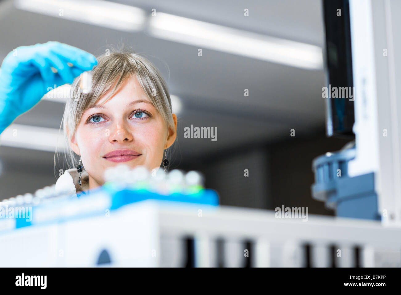 Portrait of a female researcher carrying out research in a chemistry ...