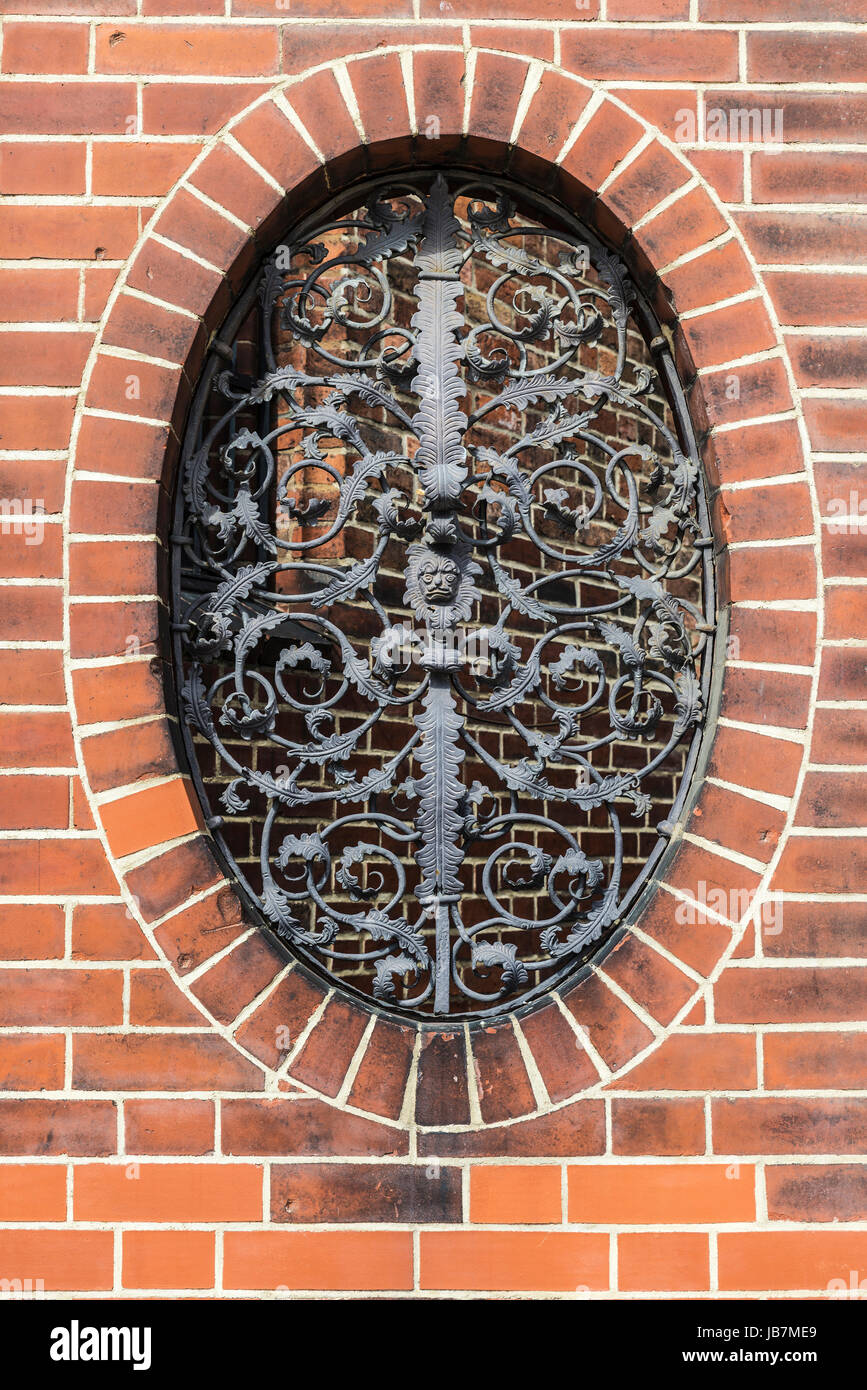 Wall with wrought iron window in St Mary church (Marienkirche) located ...