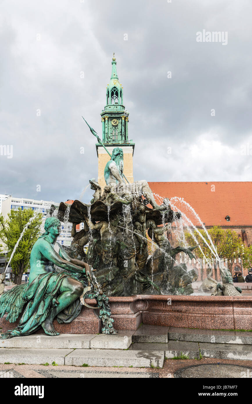 Neptune fountain (Neptunbrunnen) with the St Mary church (Marienkirche ...