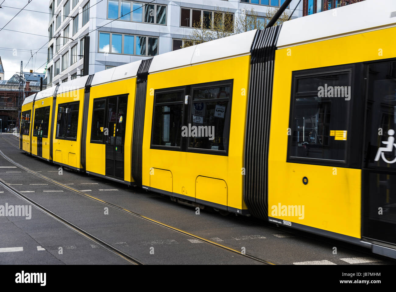 Yellow tram circulating with a sign of handicapped in Berlin, Germany ...