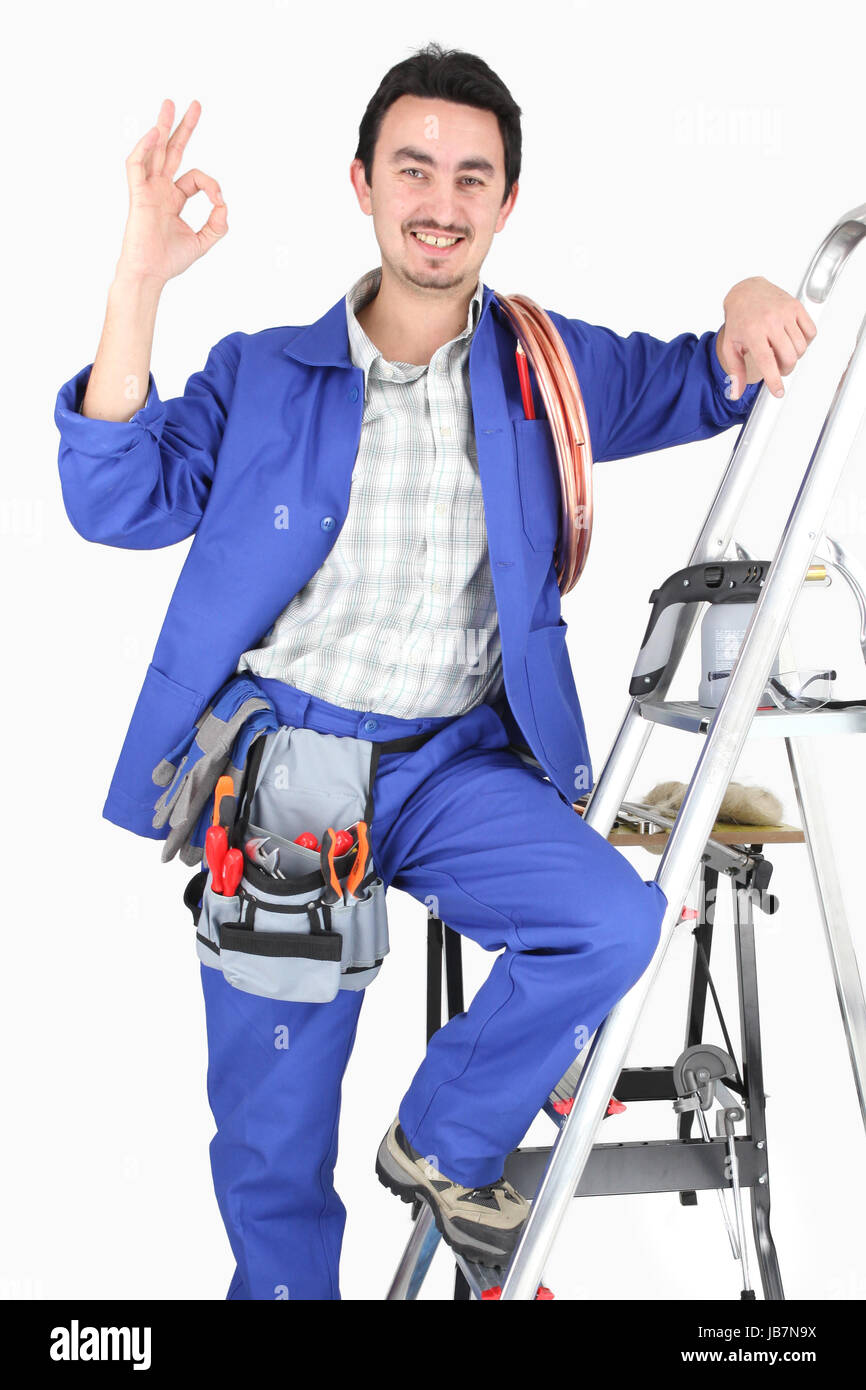 Man with ladder and plumbing tools Stock Photo - Alamy