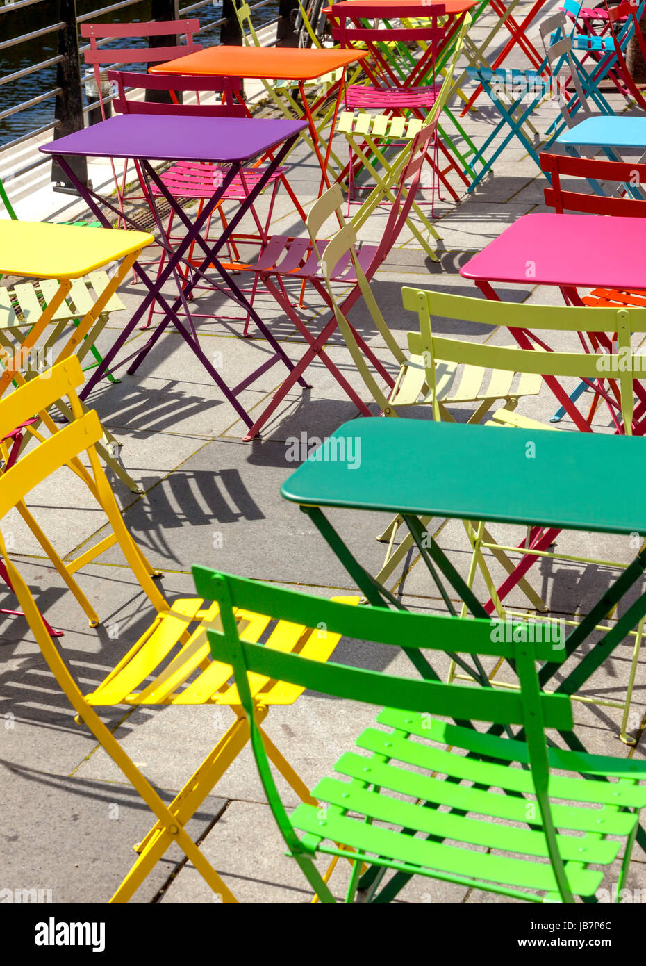Vibrant colorful chairs and tables at outdoor area of cafe at Aarhus ...