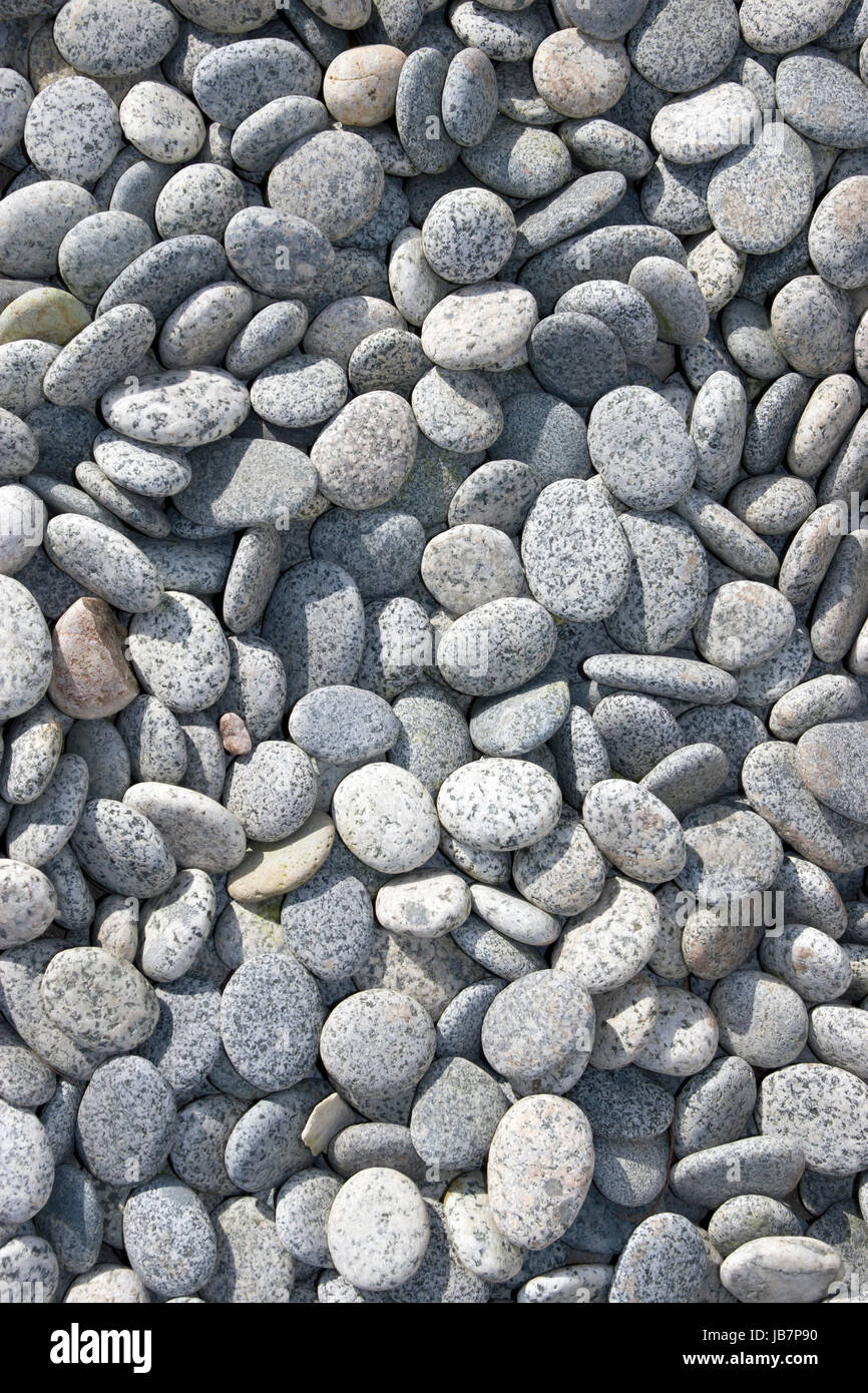 blue grey pebbles rounded from coastal erosion Stock Photo - Alamy
