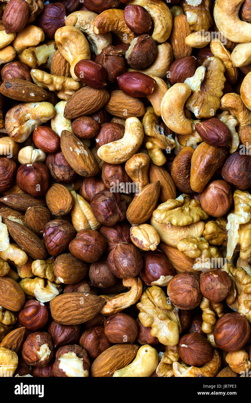Background mix of nuts and raisins shot close-up Stock Photo - Alamy