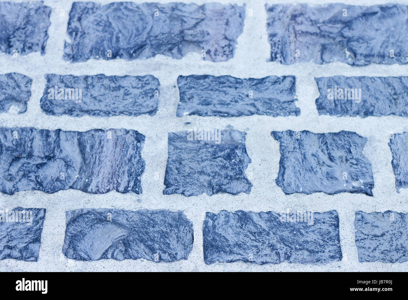 Blue bricks on a path Stock Photo - Alamy