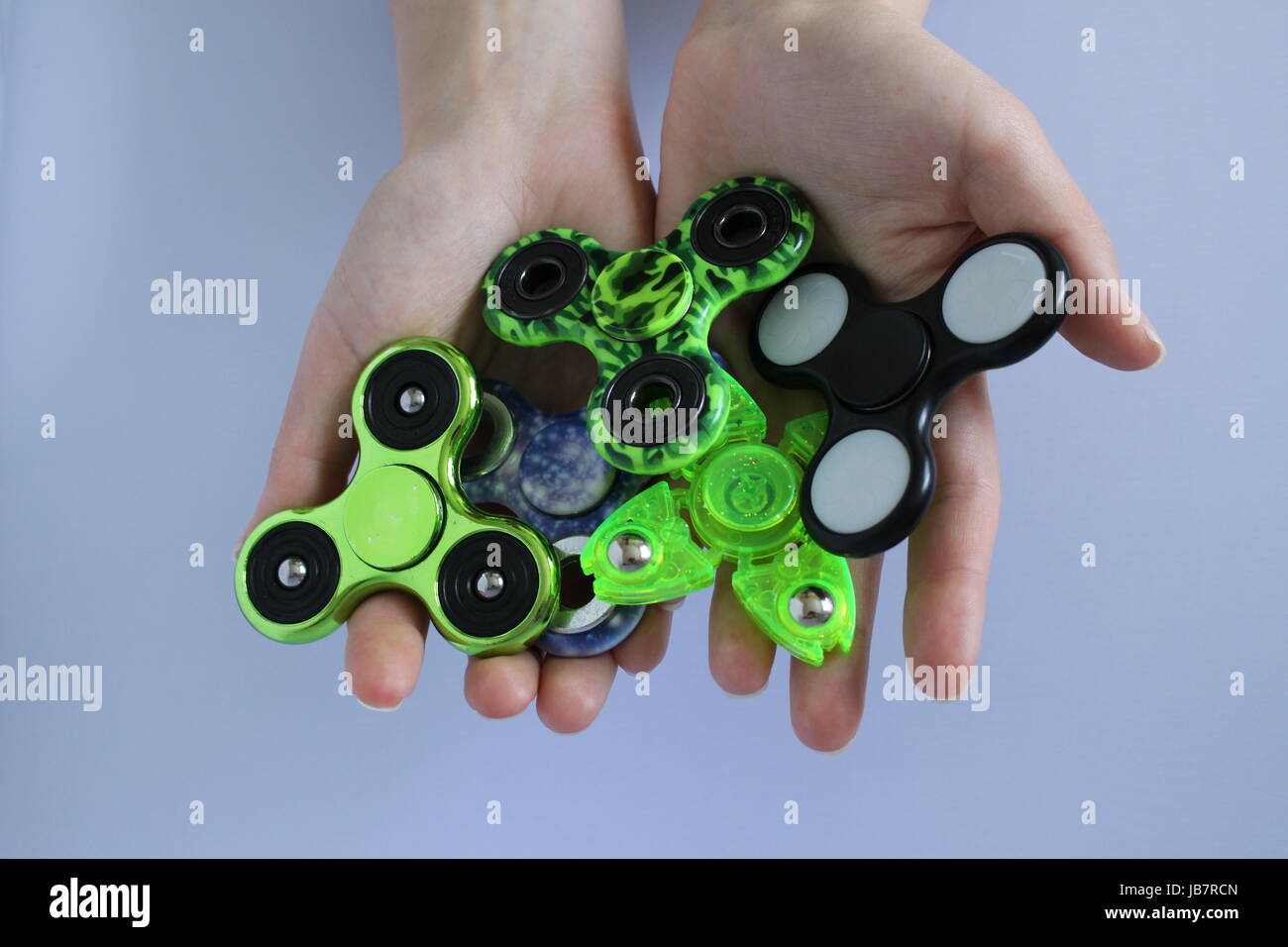 Toy stress Fidget spinner hand for child and adult colorful Stock Photo ...