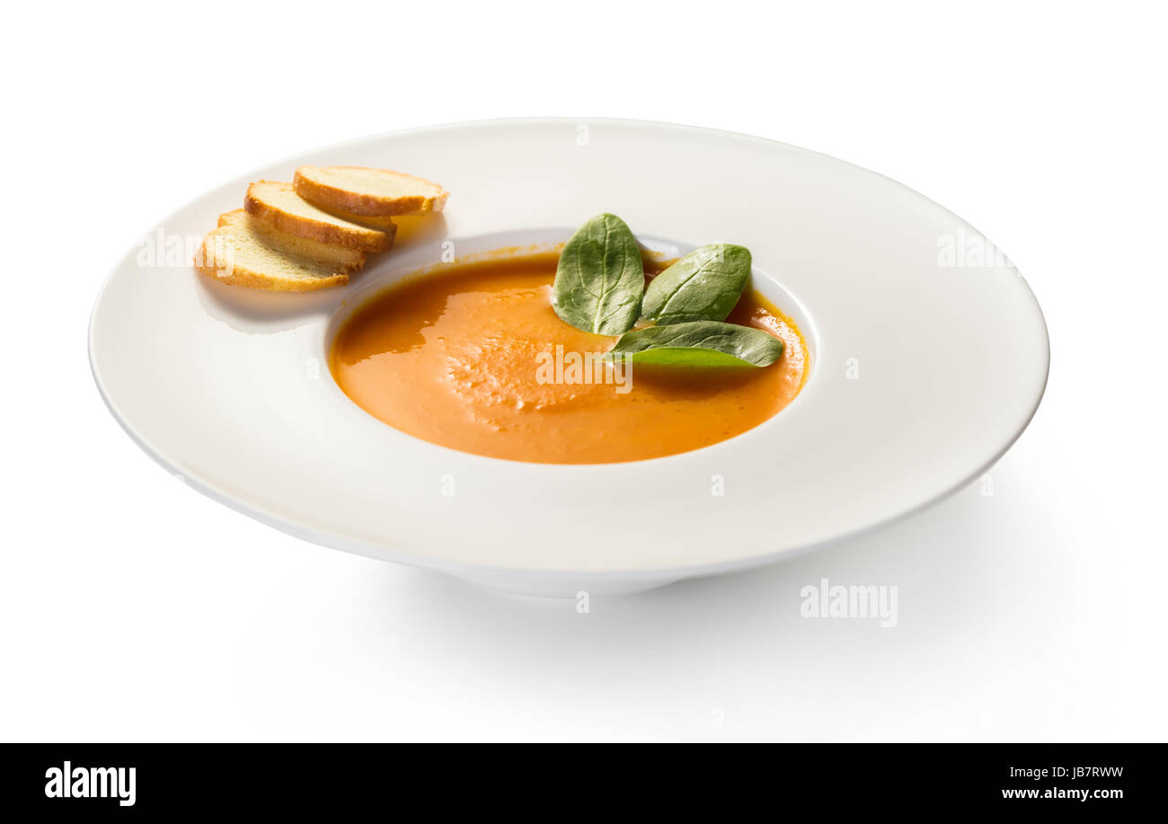 Carrot cream soup puree on white background Stock Photo - Alamy