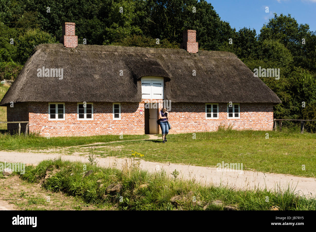A young woman is running around in an open air museum Stock Photo - Alamy