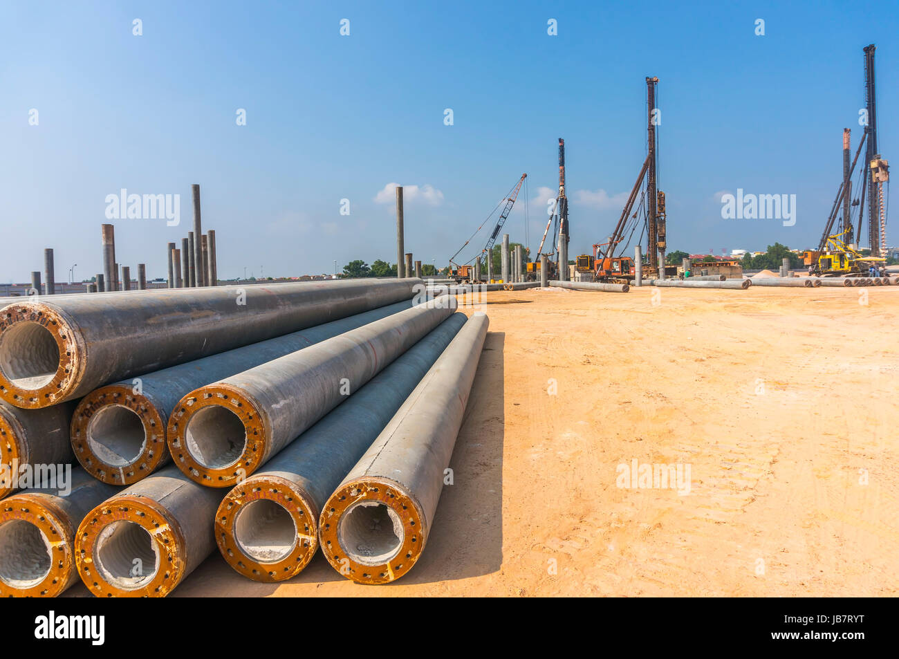 Piling work at construction site with blue skies background Stock Photo ...