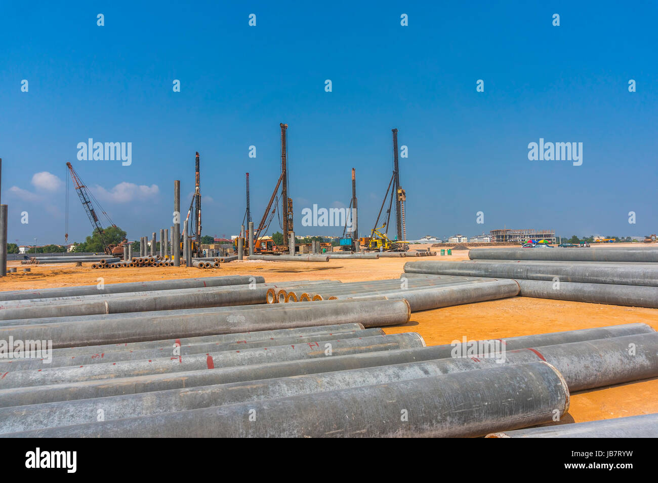 Piling work at construction site with blue skies background Stock Photo ...