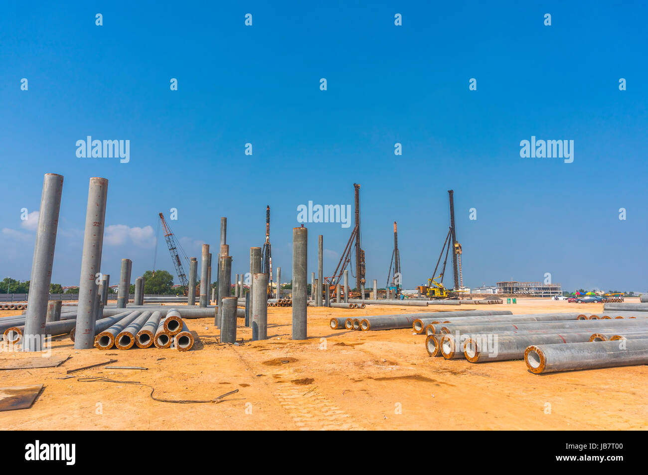 Piling work at construction site with blue skies background Stock Photo ...