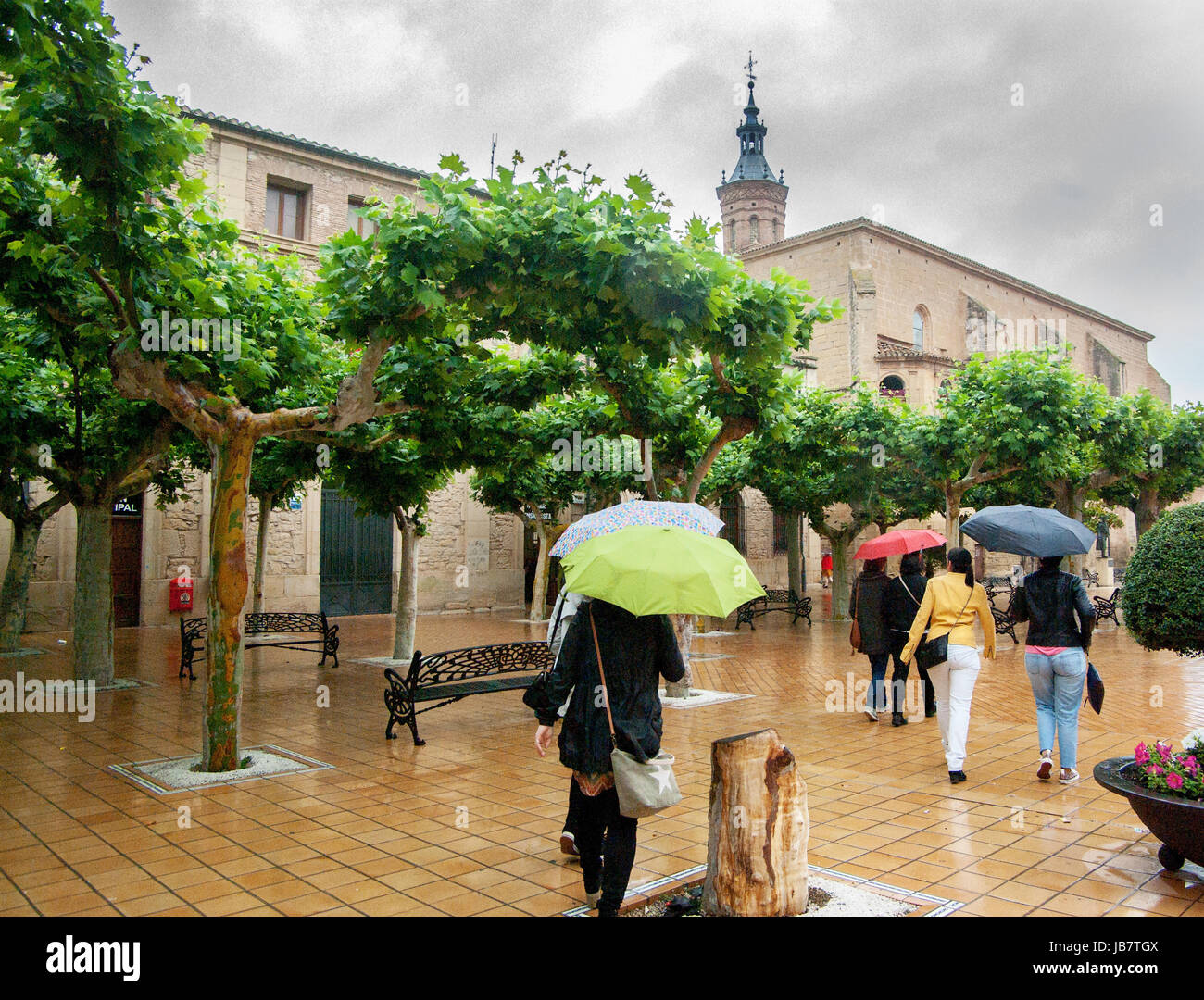 Womwn walking in the rain with umerellas in Fuenmayor, Spain Stock ...
