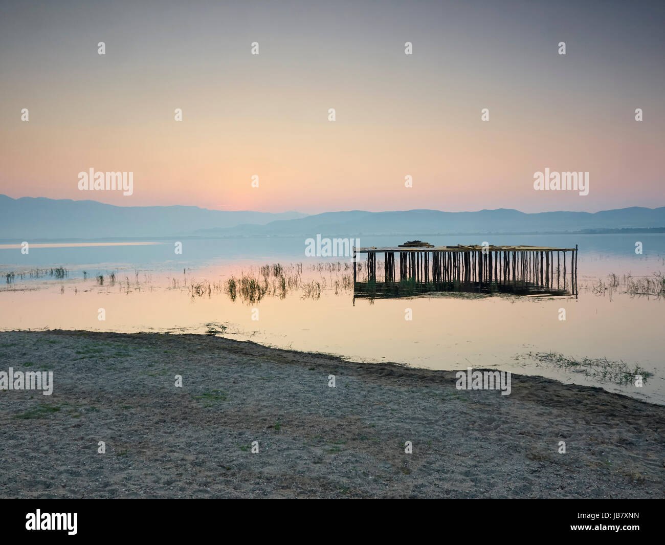 Lake and dock in dawn Stock Photo - Alamy