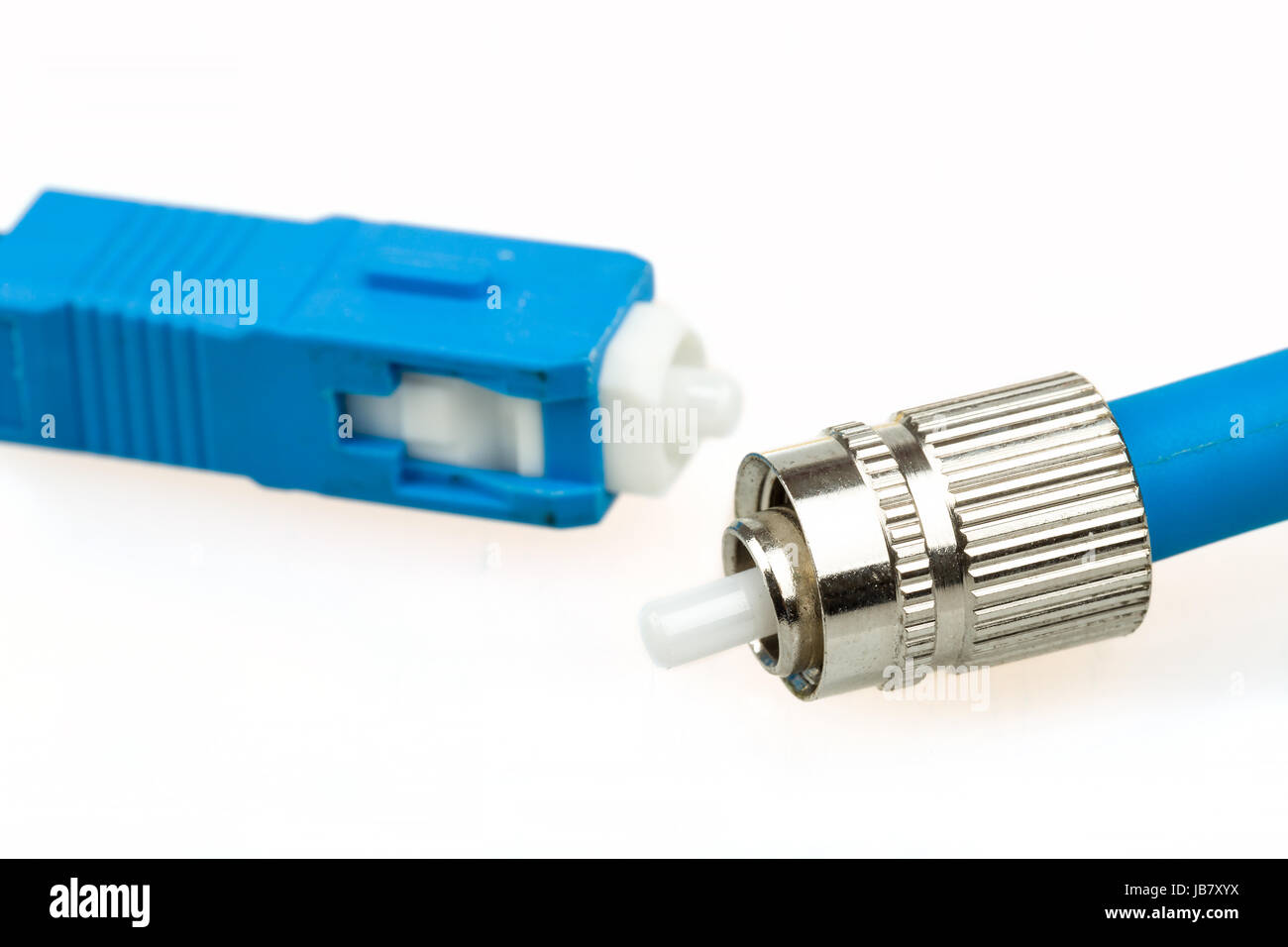 blue fiber optic SC connector and FC type connector on white background ...